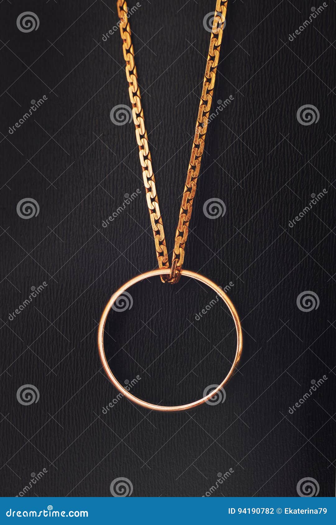Wedding Ring Hanging on Gold Chain Stock Photo - Image of background ...