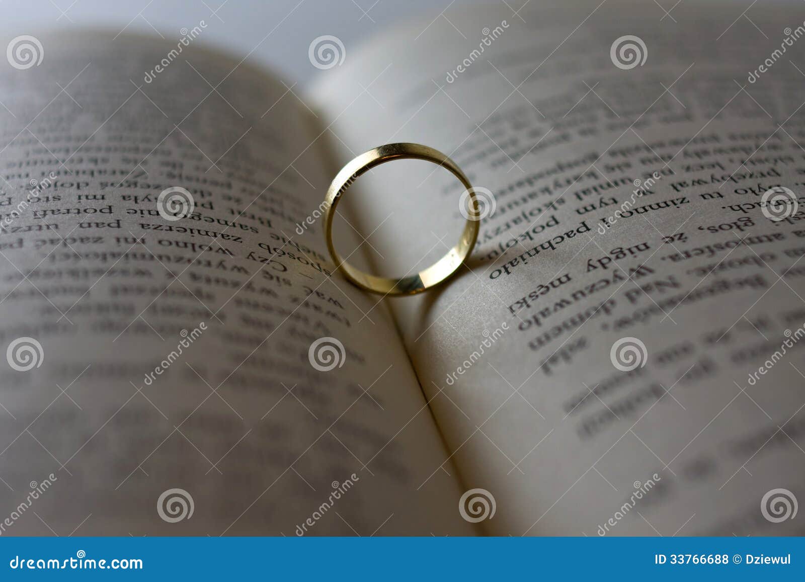 Wedding Ring Lying on an Open Book Stock Photo - Image of ceremony ...
