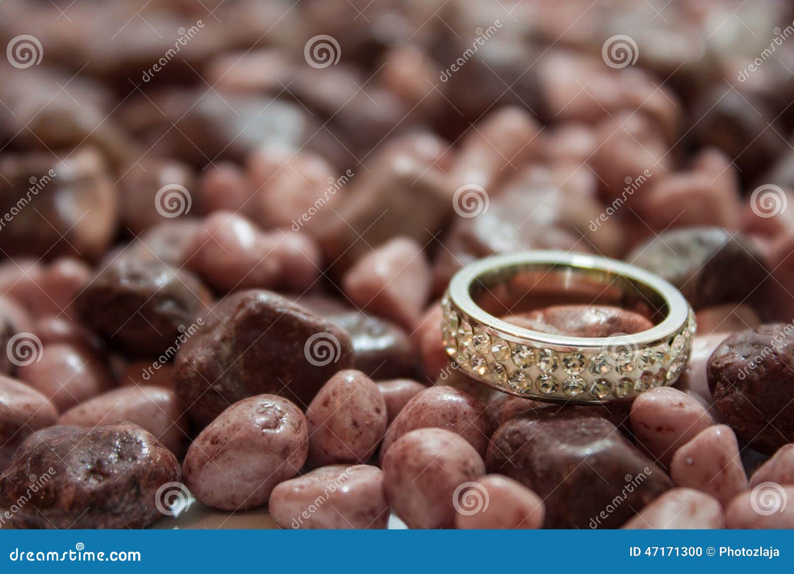 Wedding ring on the stones stock photo. Image of love - 47171300