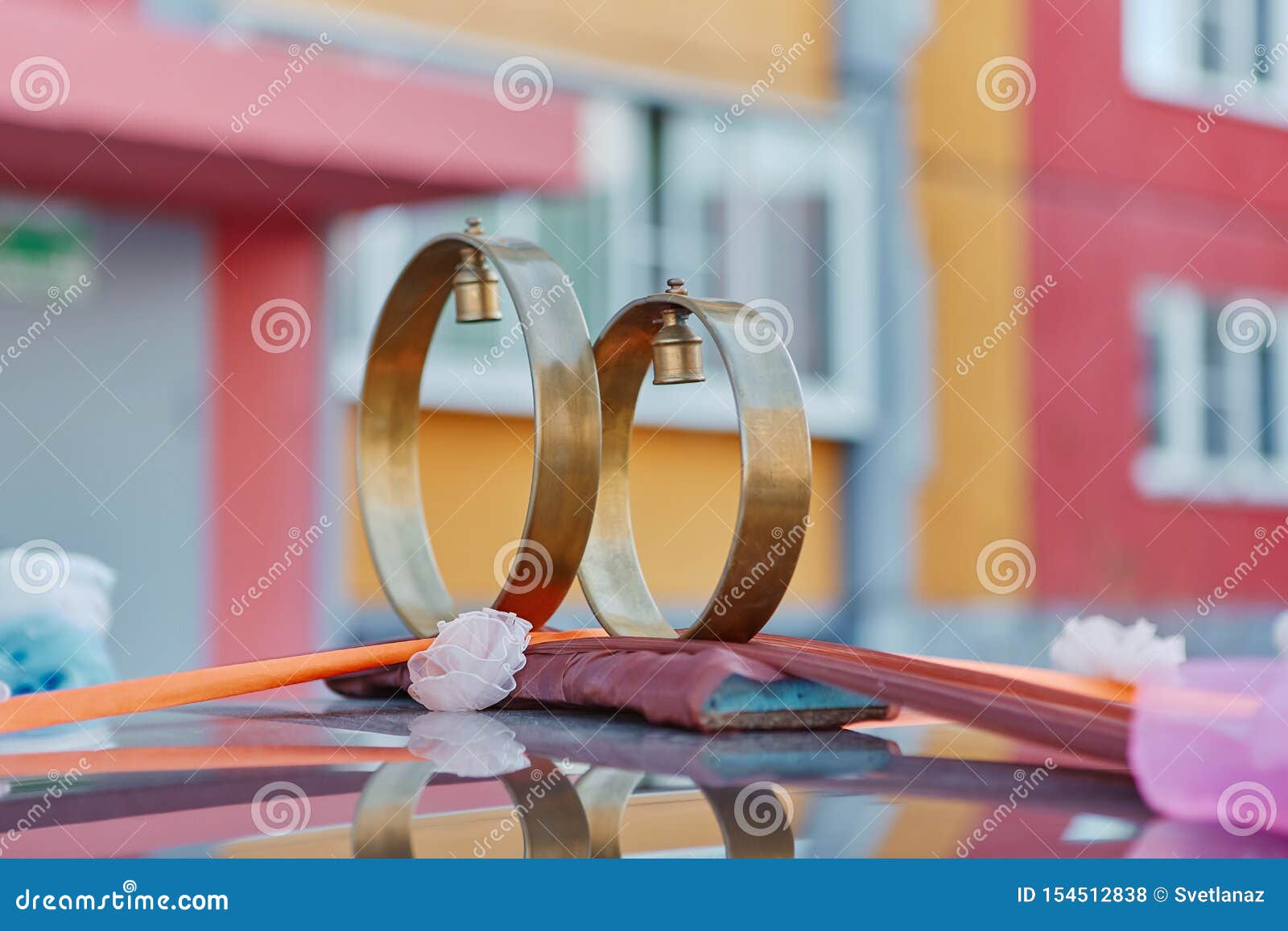 Wedding rings on the car stock photo. Image of decorated - 154512838