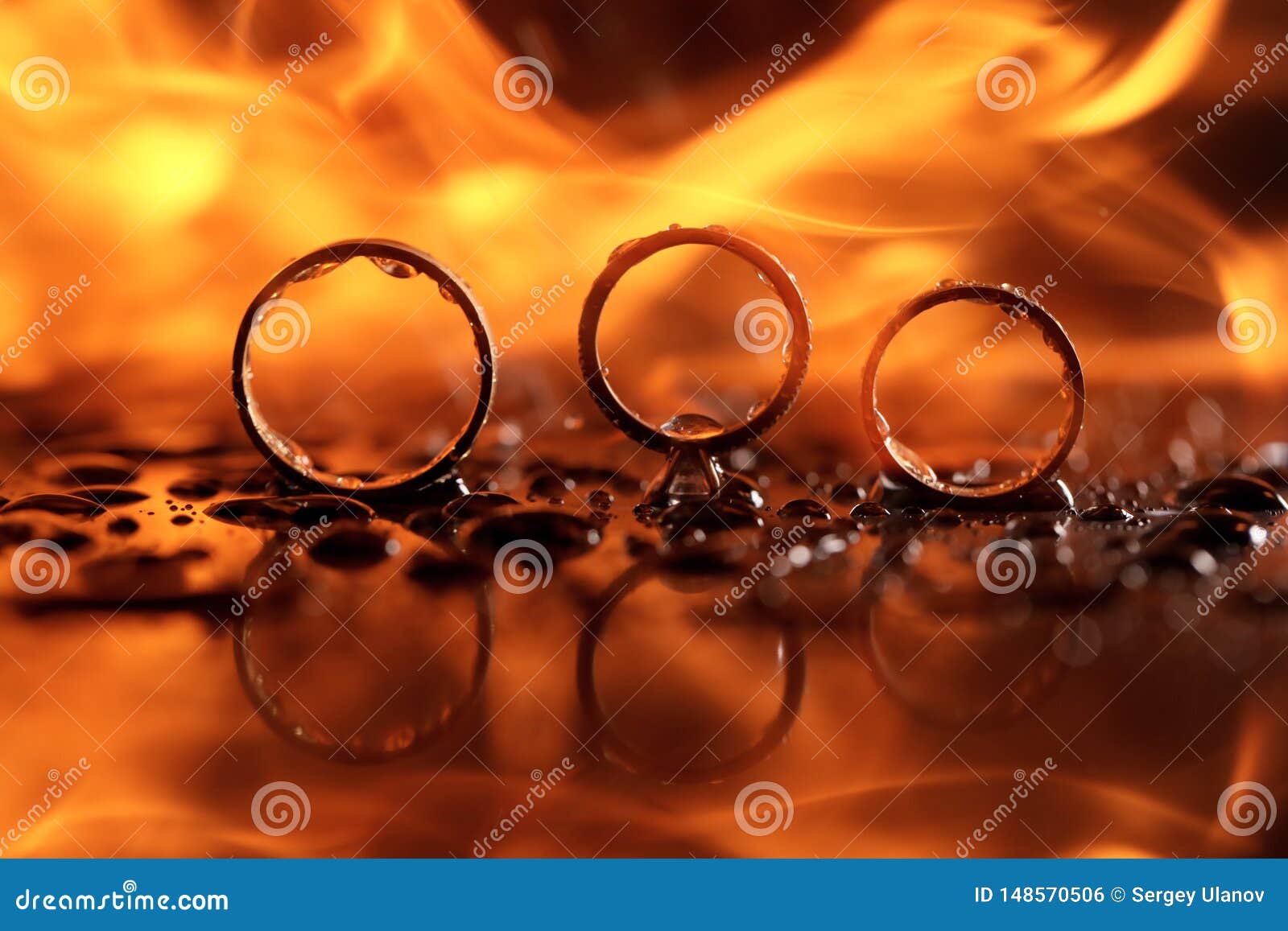Beautiful Wedding Rings on Fire with Reflection and in Water Stock ...