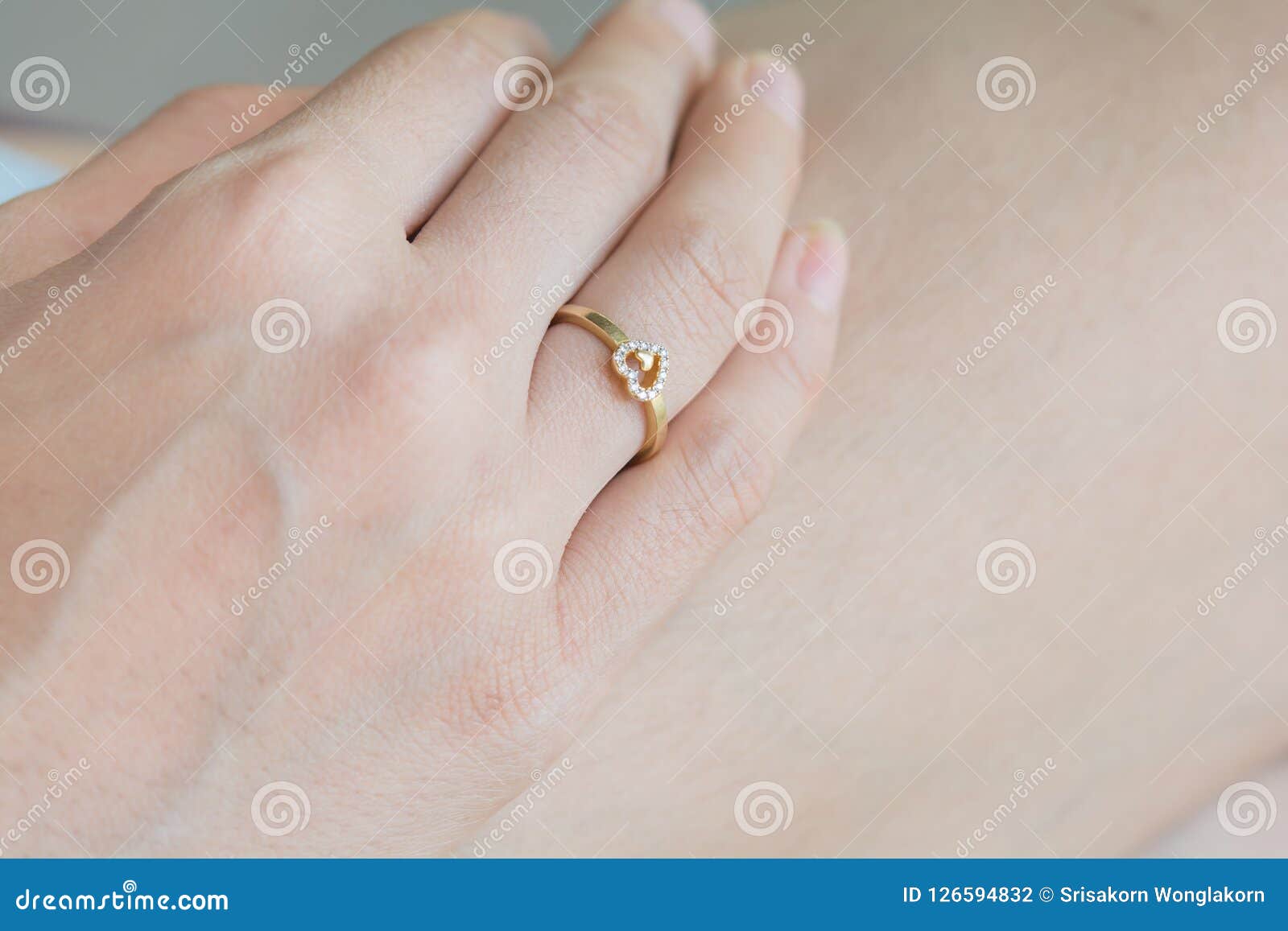 A Heart-shaped Ring on a Finger Stock Photo - Image of rings, female ...