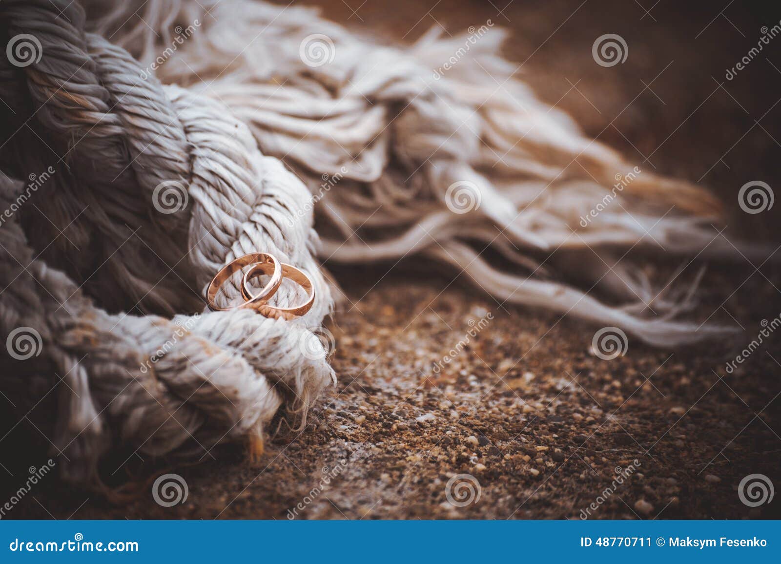 Wedding Rings Laying on Rope Stock Image - Image of sharing, gold: 48770711