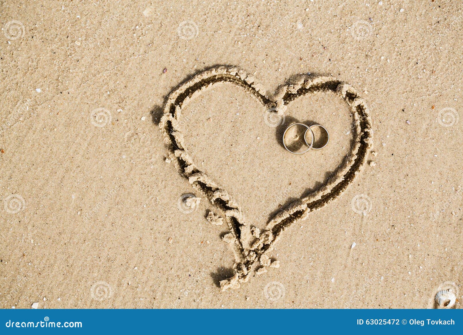 Wedding Rings Lie in the Sand Stock Photo - Image of celebration ...