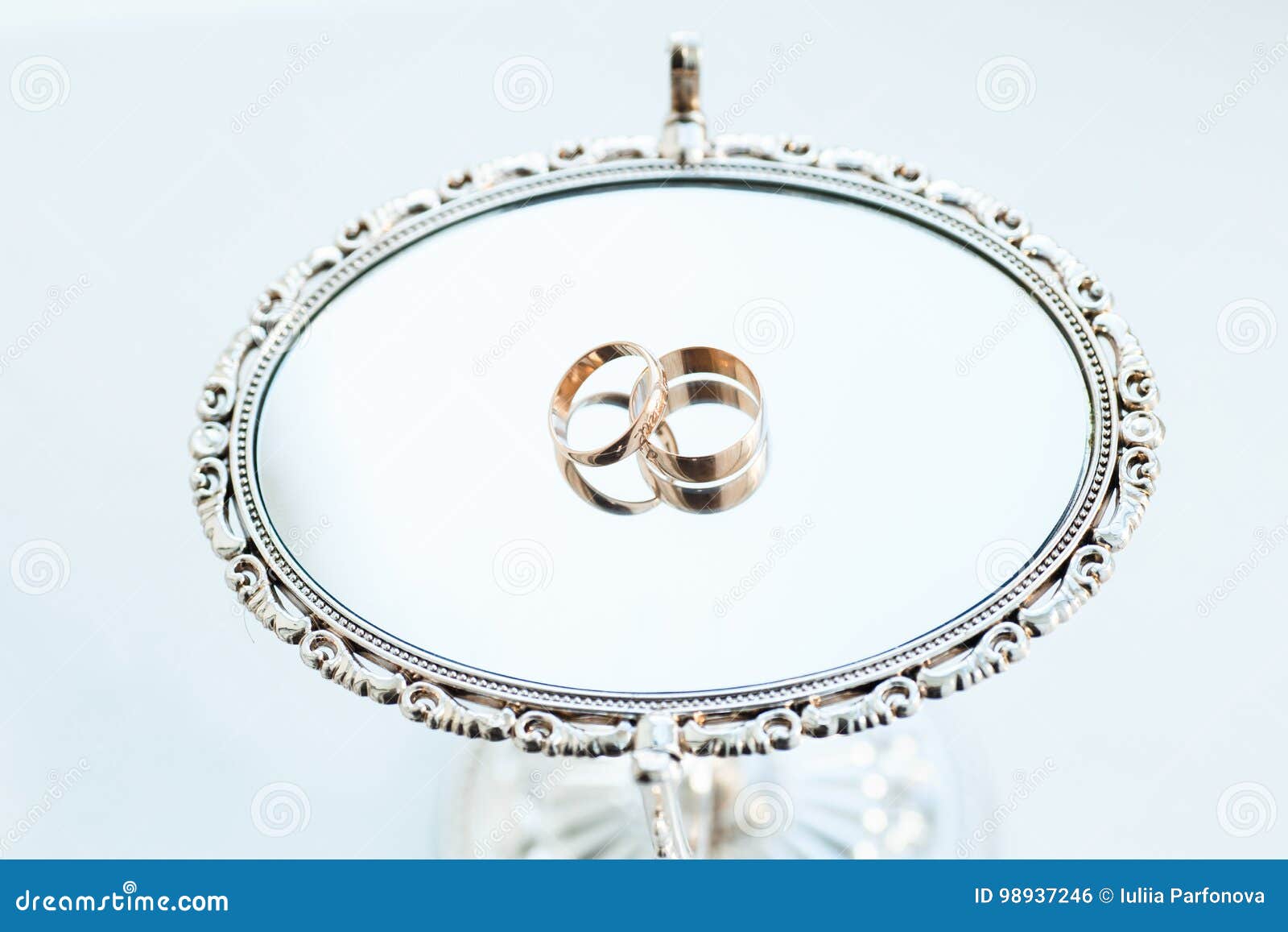 Wedding rings on a mirror stock photo. Image of antiquity - 98937246