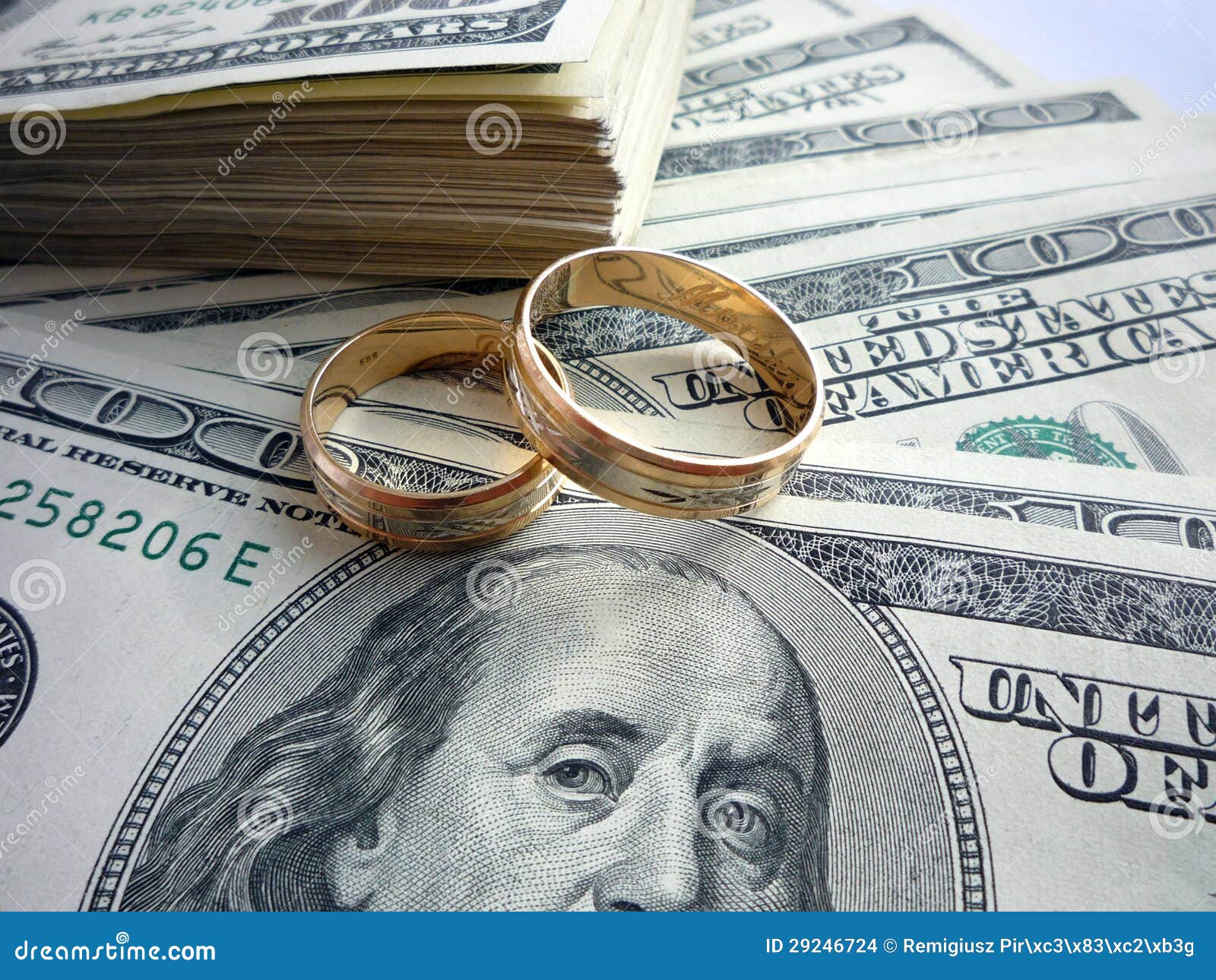 Wedding rings on the money stock photo. Image of invest - 29246724