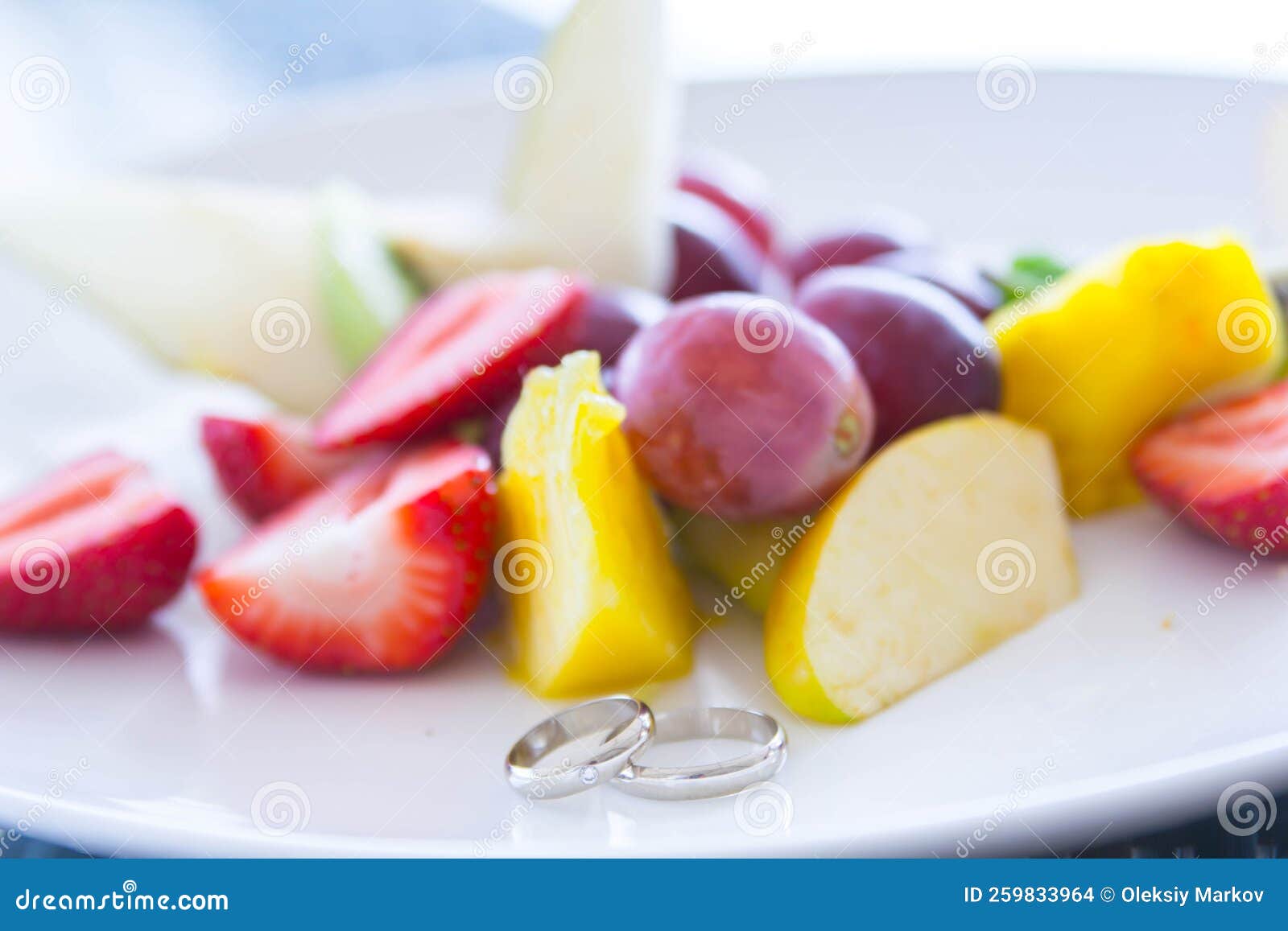 Wedding Rings on a Plate with Fruits Close-up Stock Photo - Image of ...