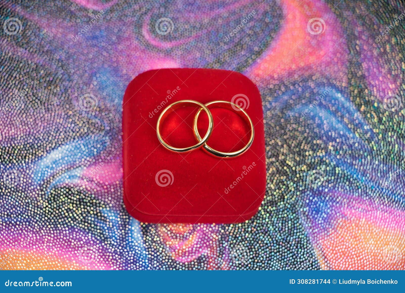Wedding Rings in a Red Box on a Multicolored Background Stock Photo ...