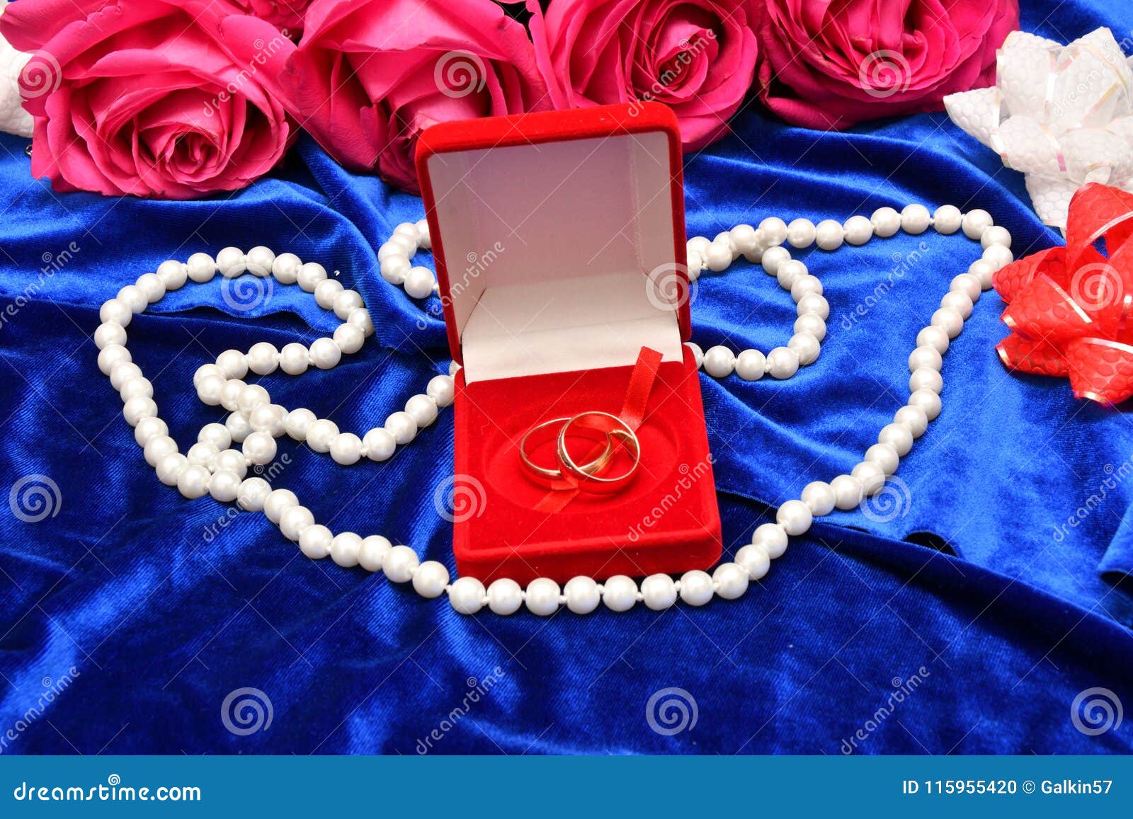 Wedding rings and roses stock photo. Image of jewelry - 115955420