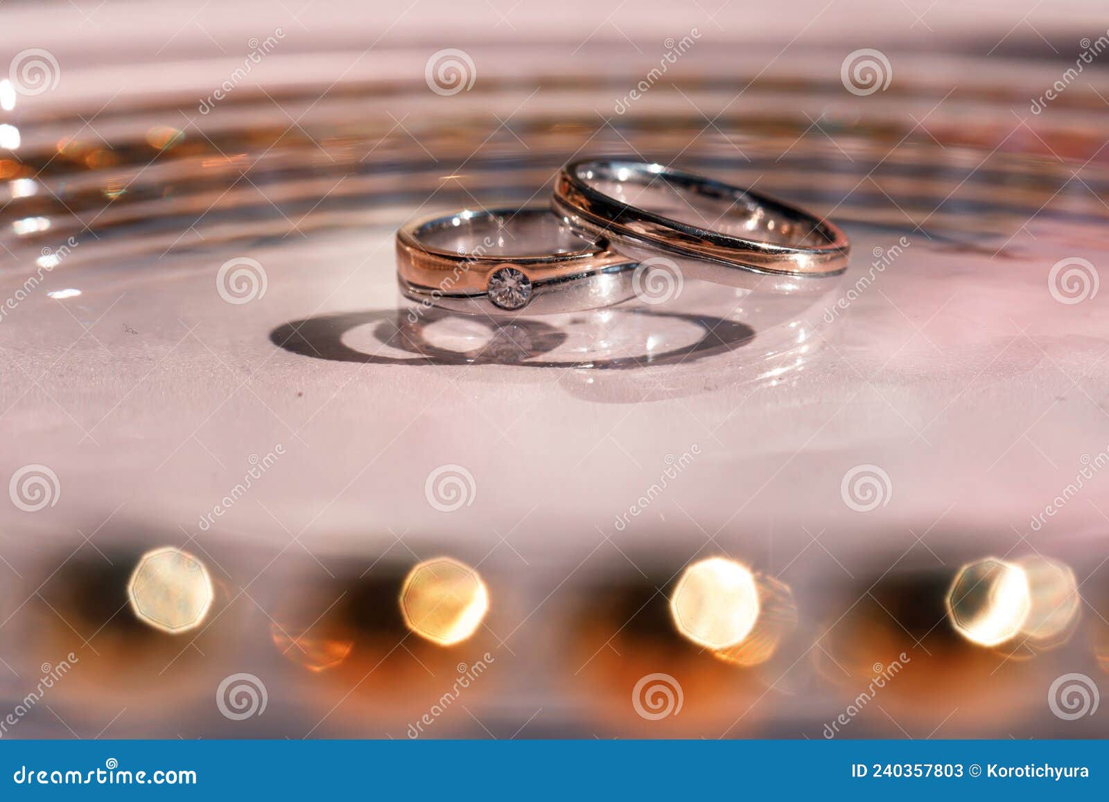 Wedding rings on the table stock image. Image of beauty - 240357803
