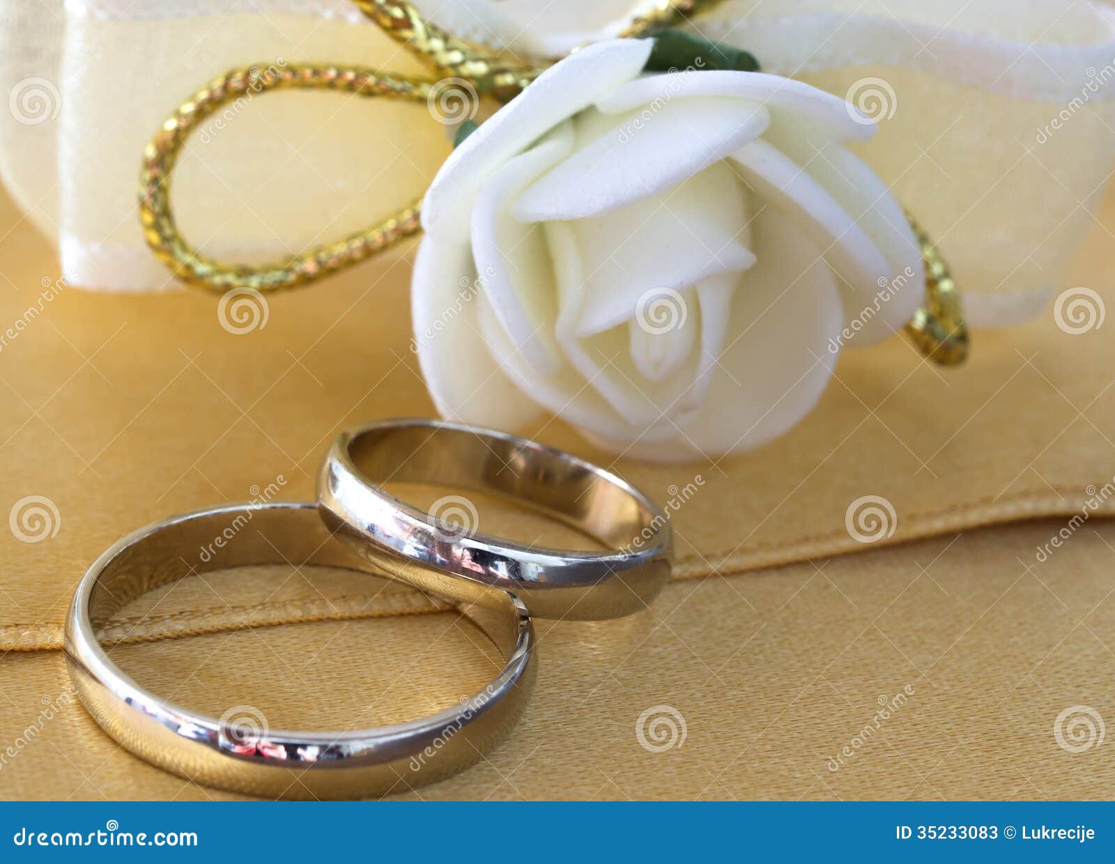 Wedding Rings on the Yellow Silk Stock Image - Image of jewelery ...