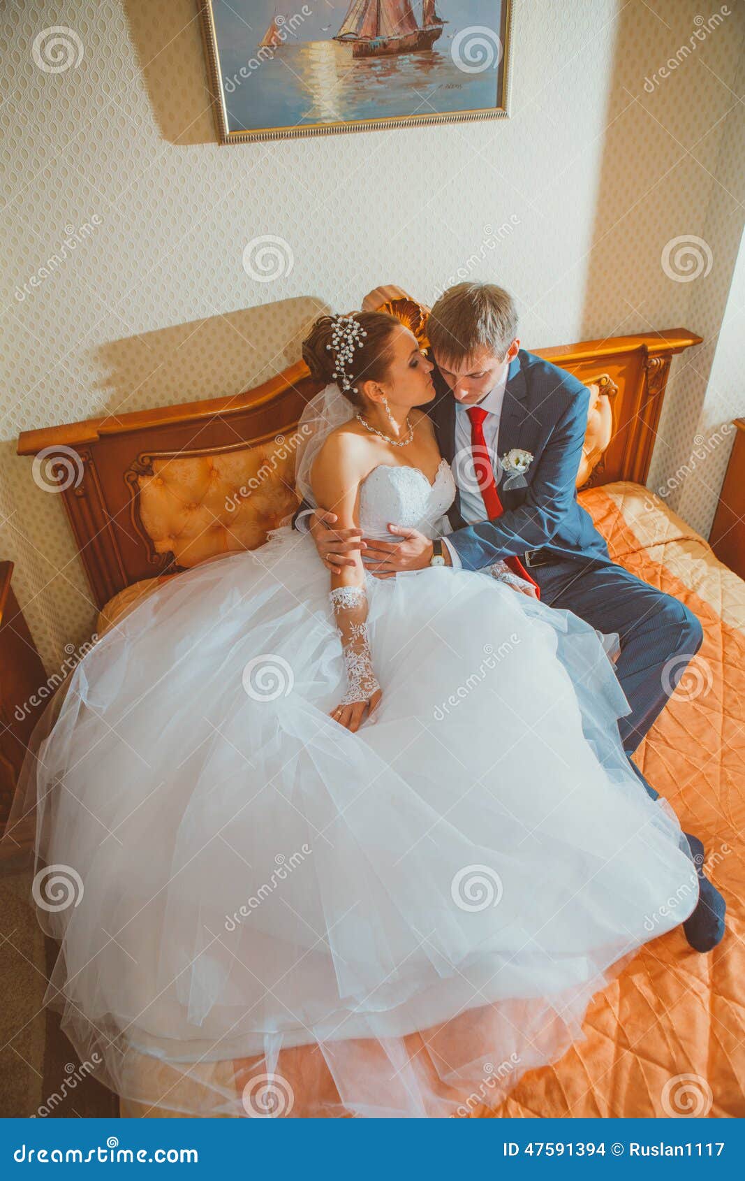 Wedding Shot of Bride and Groom Lying in a Stylish Bed Stock Photo ...