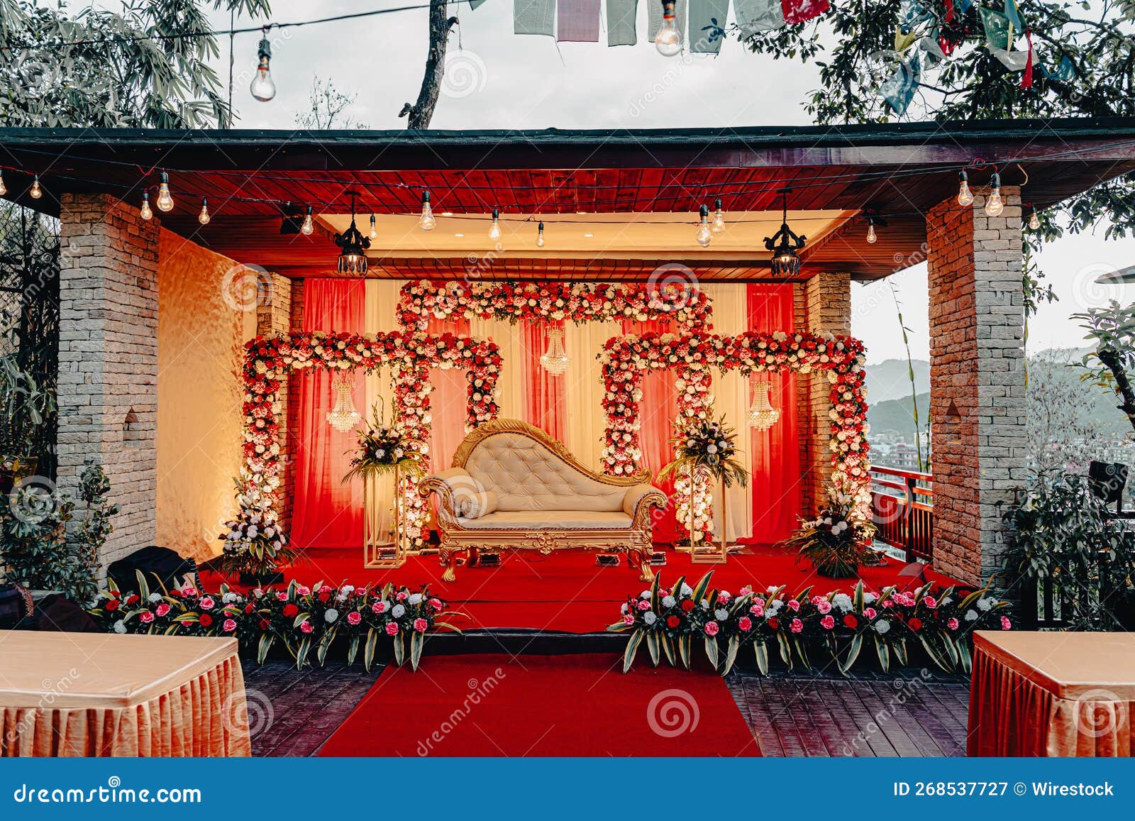 Wedding Stage Decorated in Red and Gold with White Garlands Stock Image ...