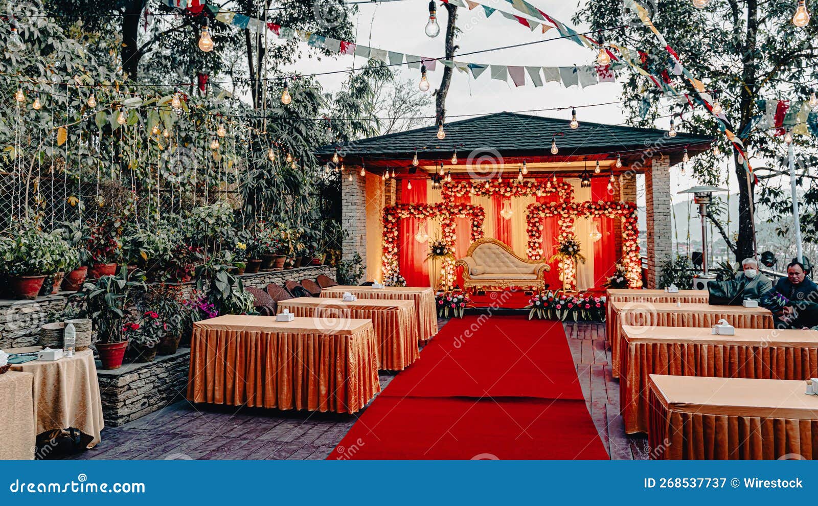 Wedding Stage Decorated in Red and Gold with White Garlands Stock Image ...