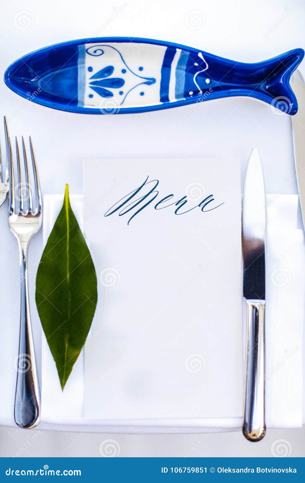 Wedding Table Setting with Porcelain Fish and Green Leaf Stock Image ...