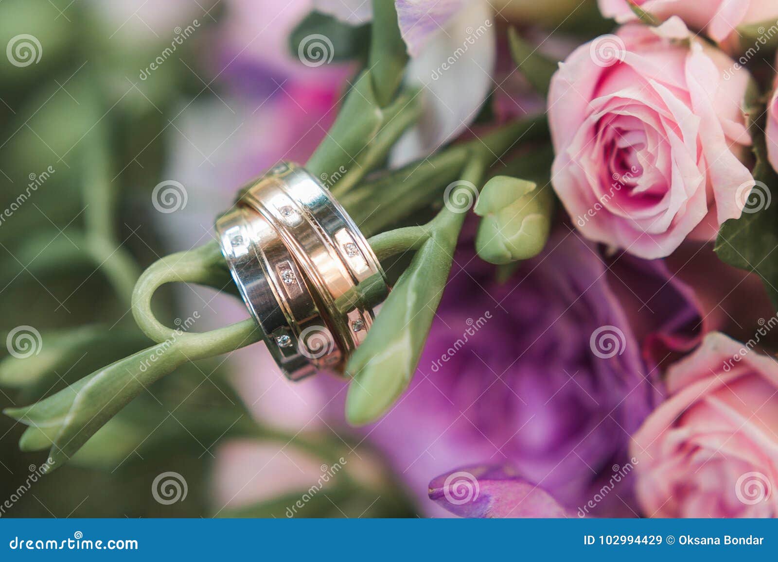 Weddings Rings with Dimonds, Bouquet Colorfull Roses on a Background ... Weddings Rings with Dimonds, Bouquet Colorfull Roses on a Background ...