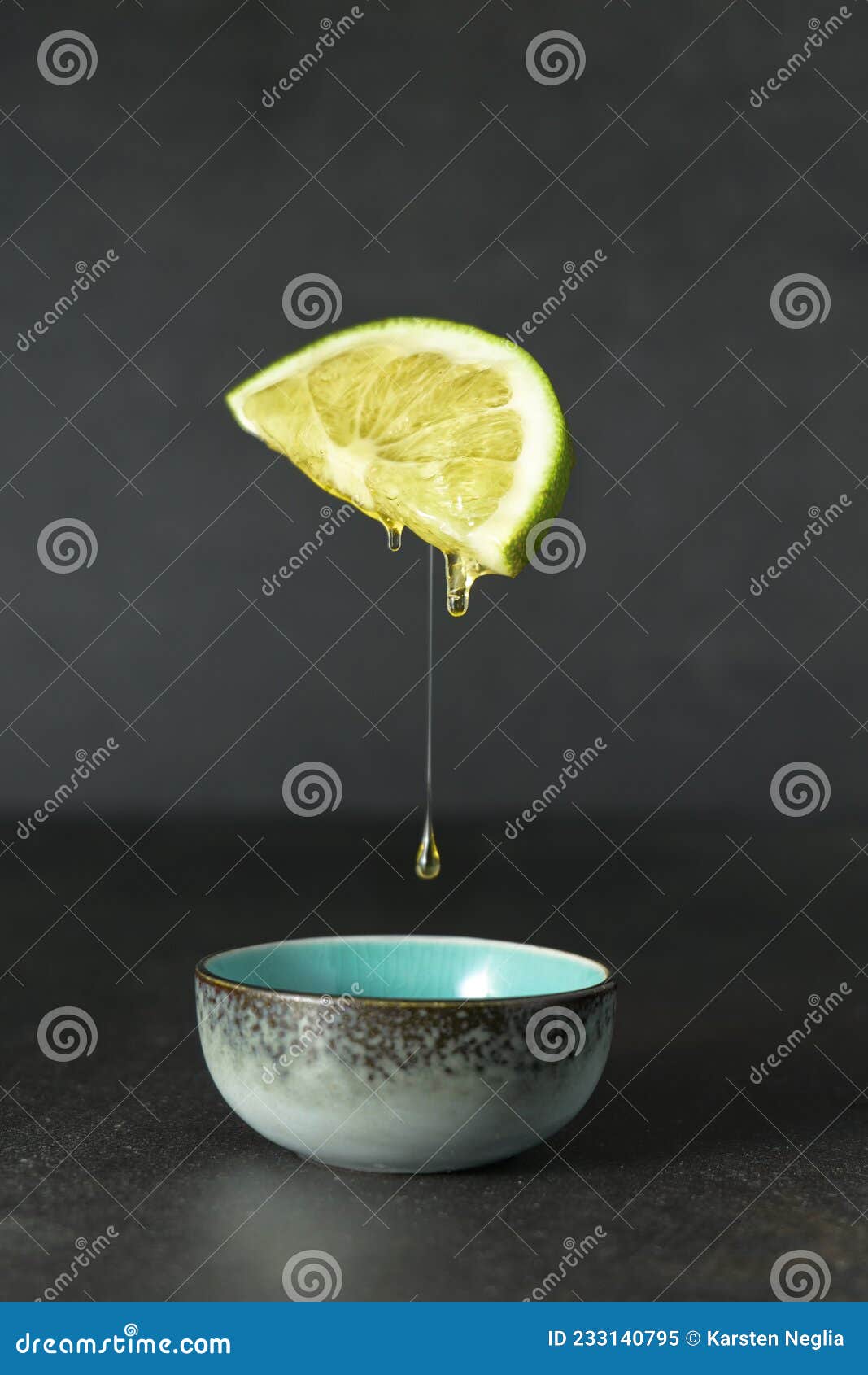 Wedge of Lime Hovers Over Small Bowl, Food Concept Stock Image - Image ...