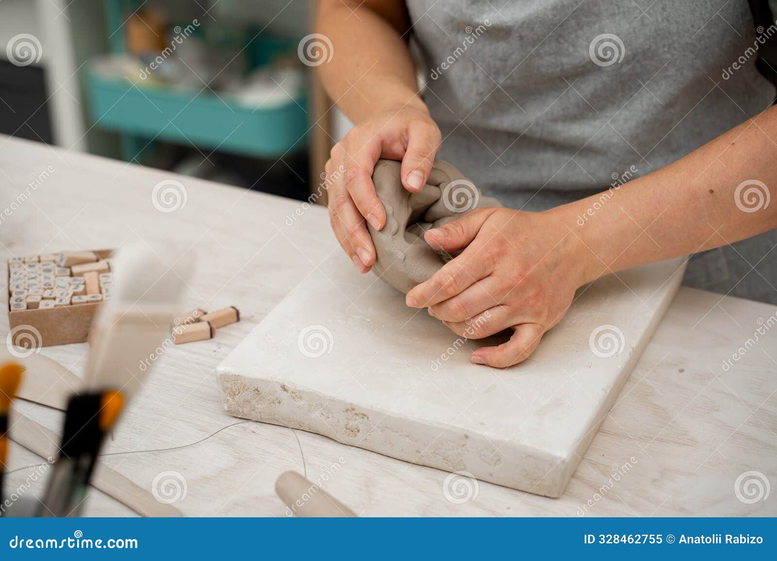 Wedging the Clay before Starting Making a Pottery Project To Create ...