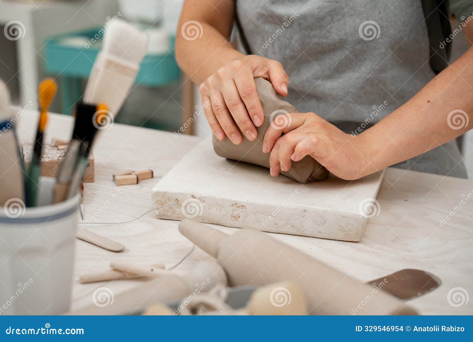 Wedging the Clay before Starting Making a Pottery Project To Create ...