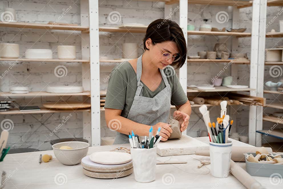 Wedging the Clay before Starting Making a Pottery Project To Create ...