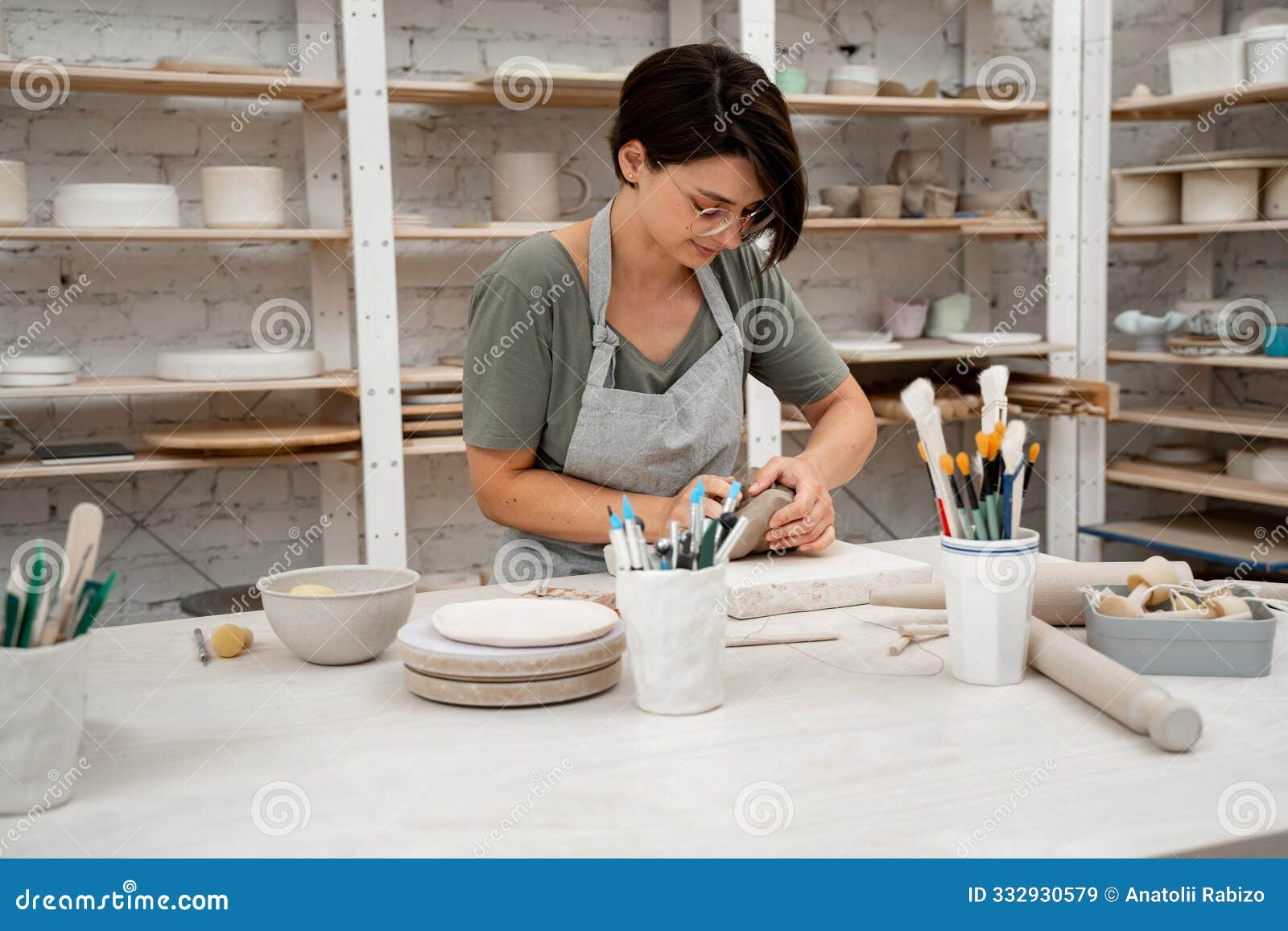 Wedging the Clay before Starting Making a Pottery Project To Create ...