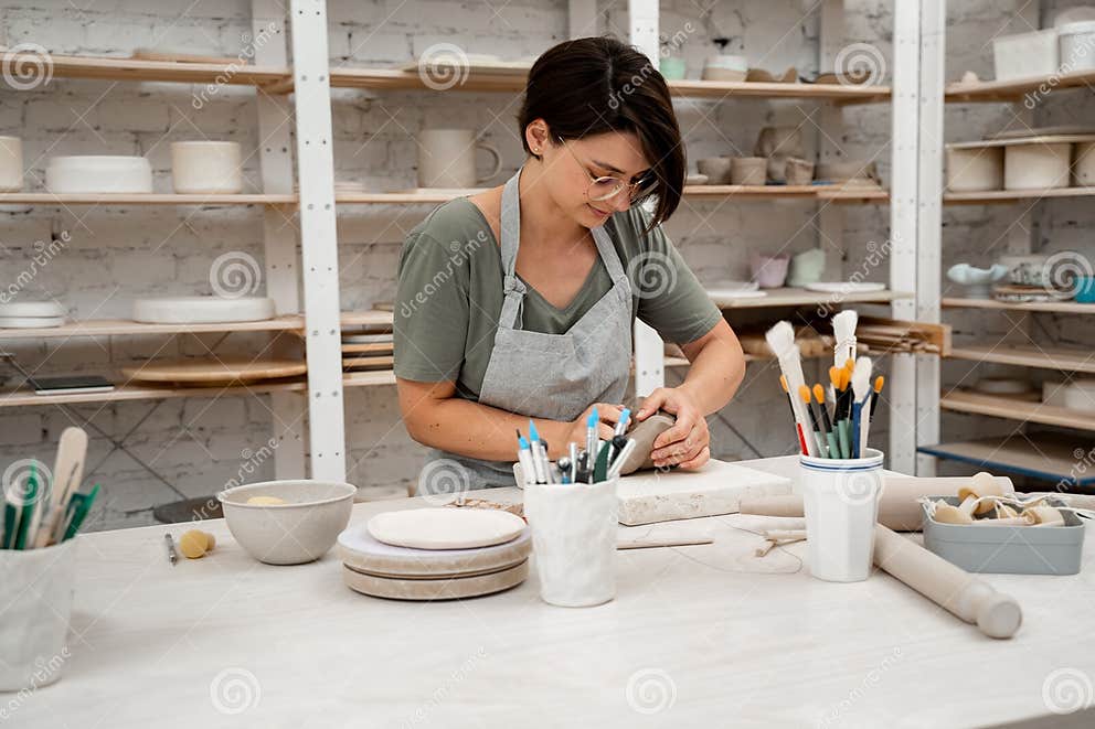 Wedging the Clay before Starting Making a Pottery Project To Create ...