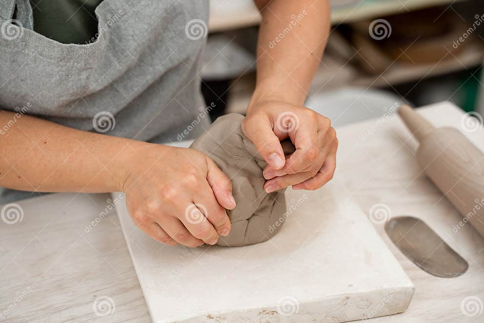 Wedging the Clay before Starting Making a Pottery Project To Create ...