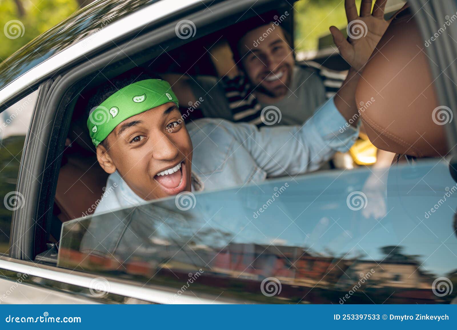Group of Friends Driving in a Car and Looking Excited Stock Image ...