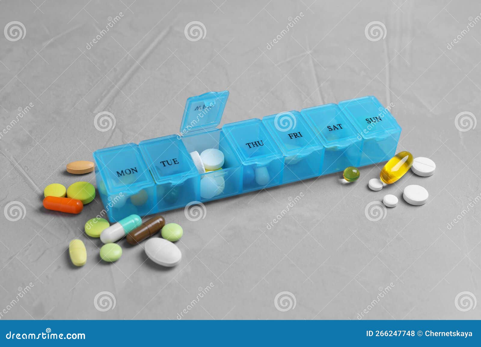 Weekly Pill Box with Medicaments on Grey Table Stock Photo - Image of ...
