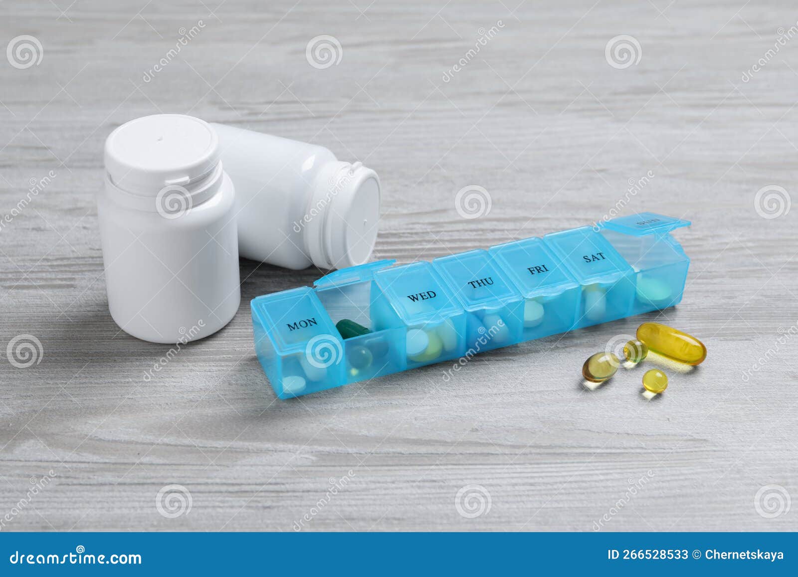Weekly Pill Box with Medicaments on Wooden Table Stock Image - Image of ...