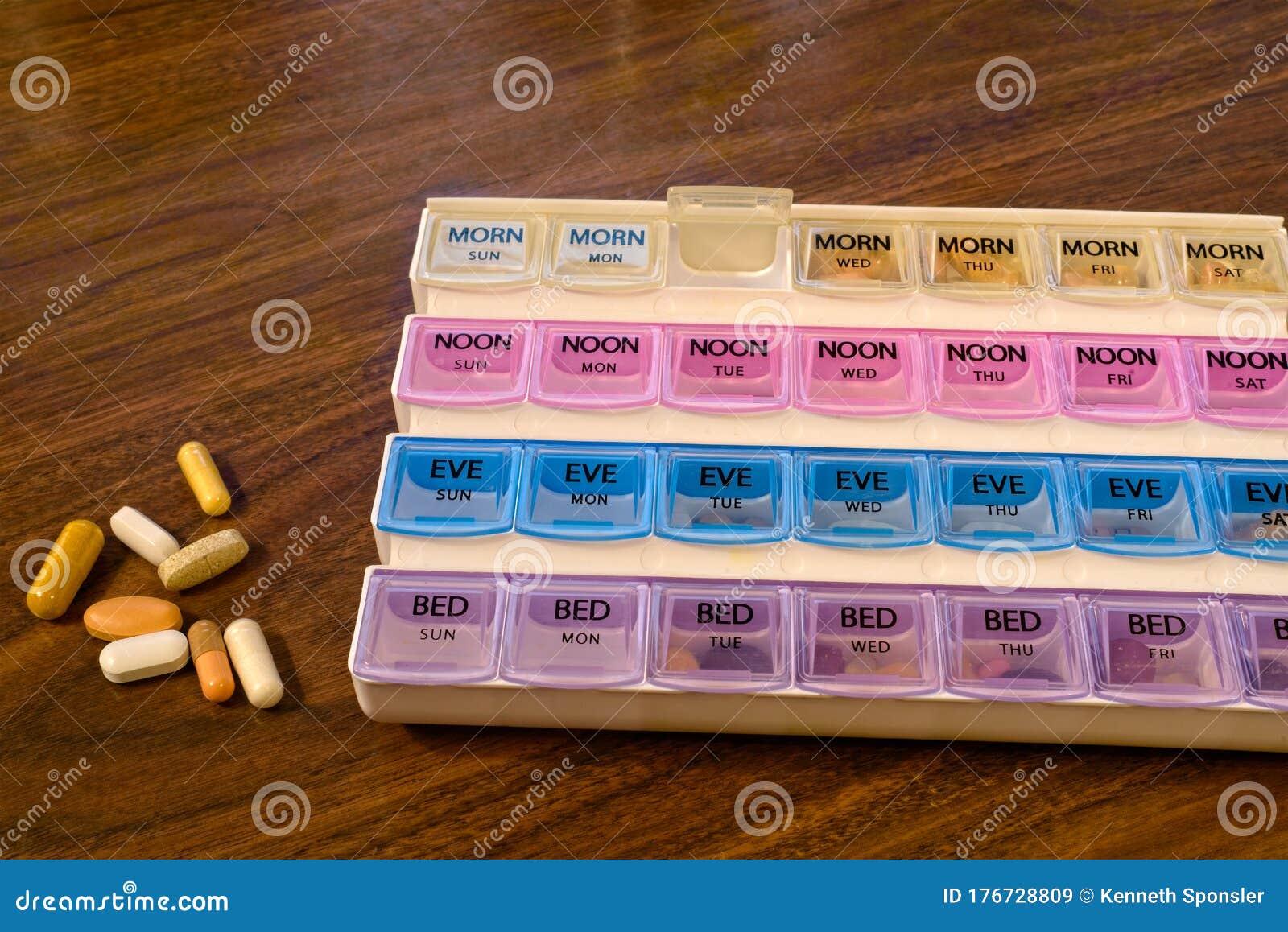 A Weekly Pill Container and Pills Stock Image - Image of pills ...