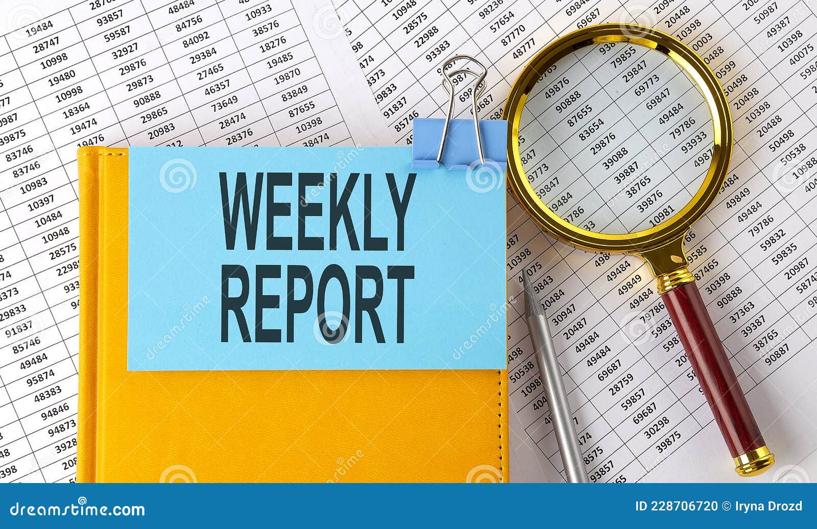 WEEKLY REPORT Text on Sticker on Notebook with Magnifier and Chart ...