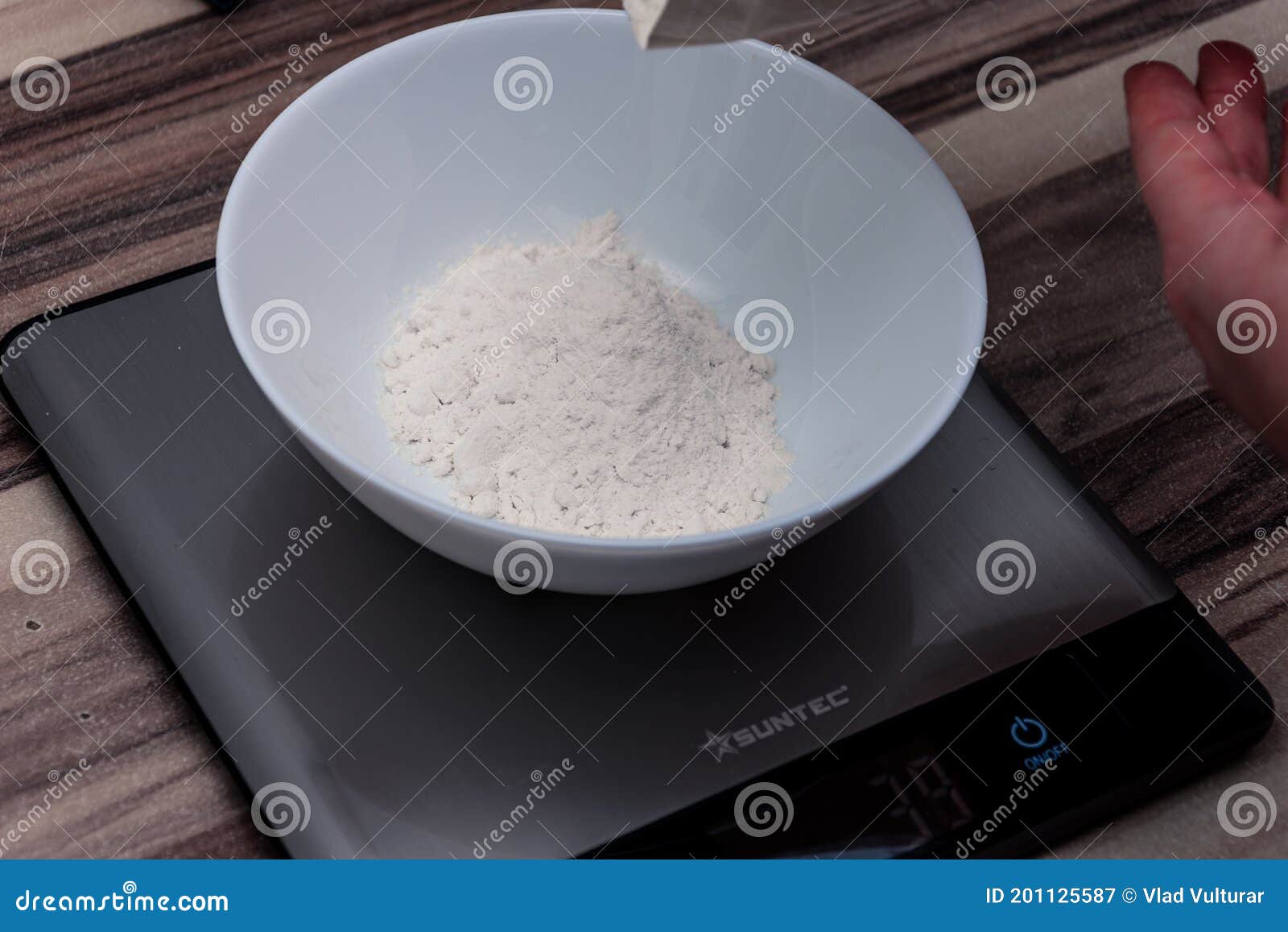 Weighing Flour for Baking with Professional Scales on the Table Stock ...