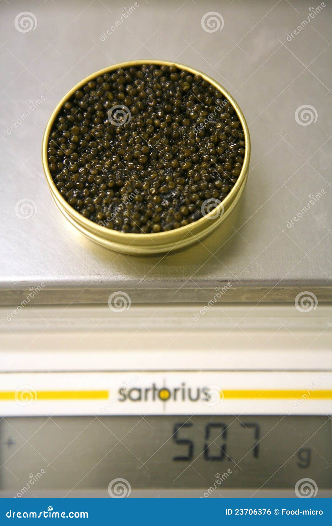 Weighing a tin of caviar editorial photo. Image of fish - 23706376