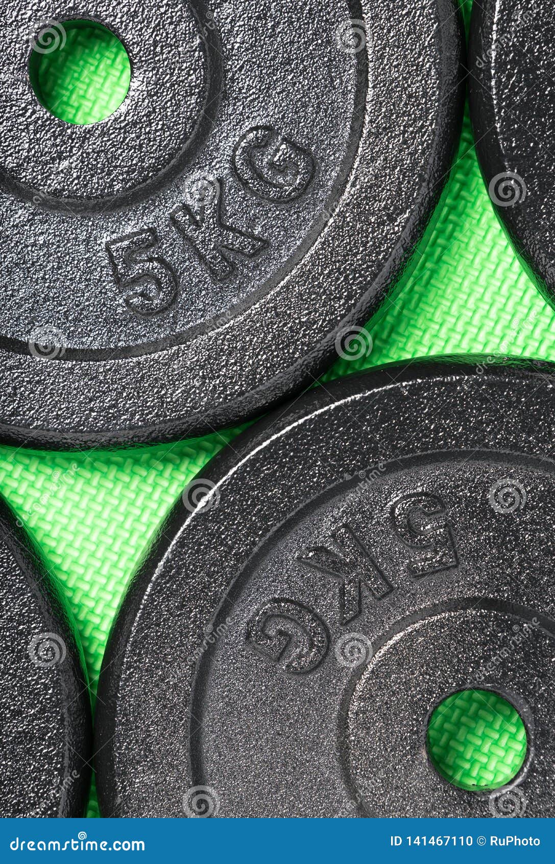Weight Plates on a Green Floor Inside a Weight Training Gym Stock Photo ...