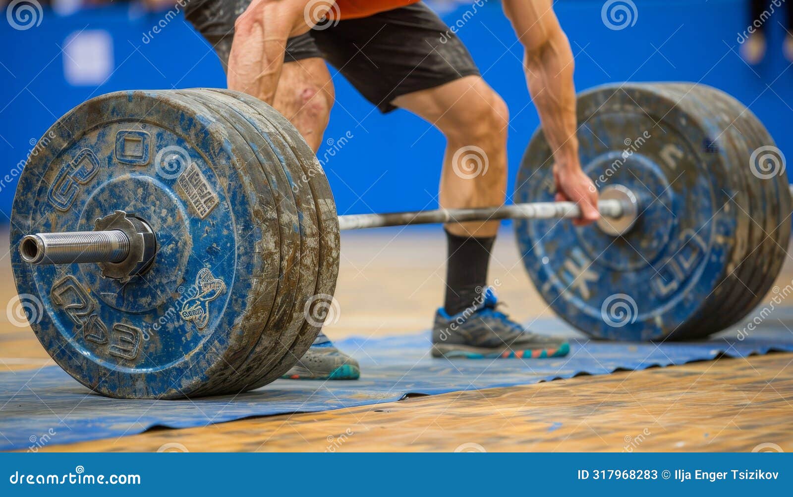 Weightlifter Showcasing Stable Footing In Squat For Summer Olympic ...