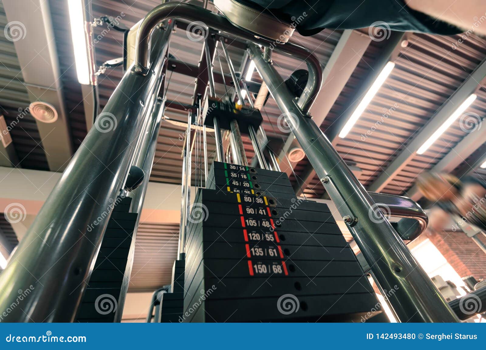 Weights in gym machine stock photo. Image of indoor - 142493480