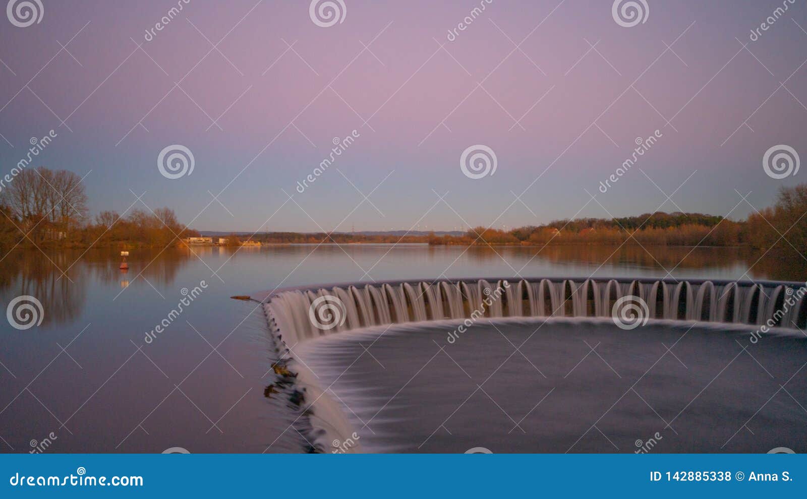 Weir of lake during sunset stock photo. Image of color - 142885338