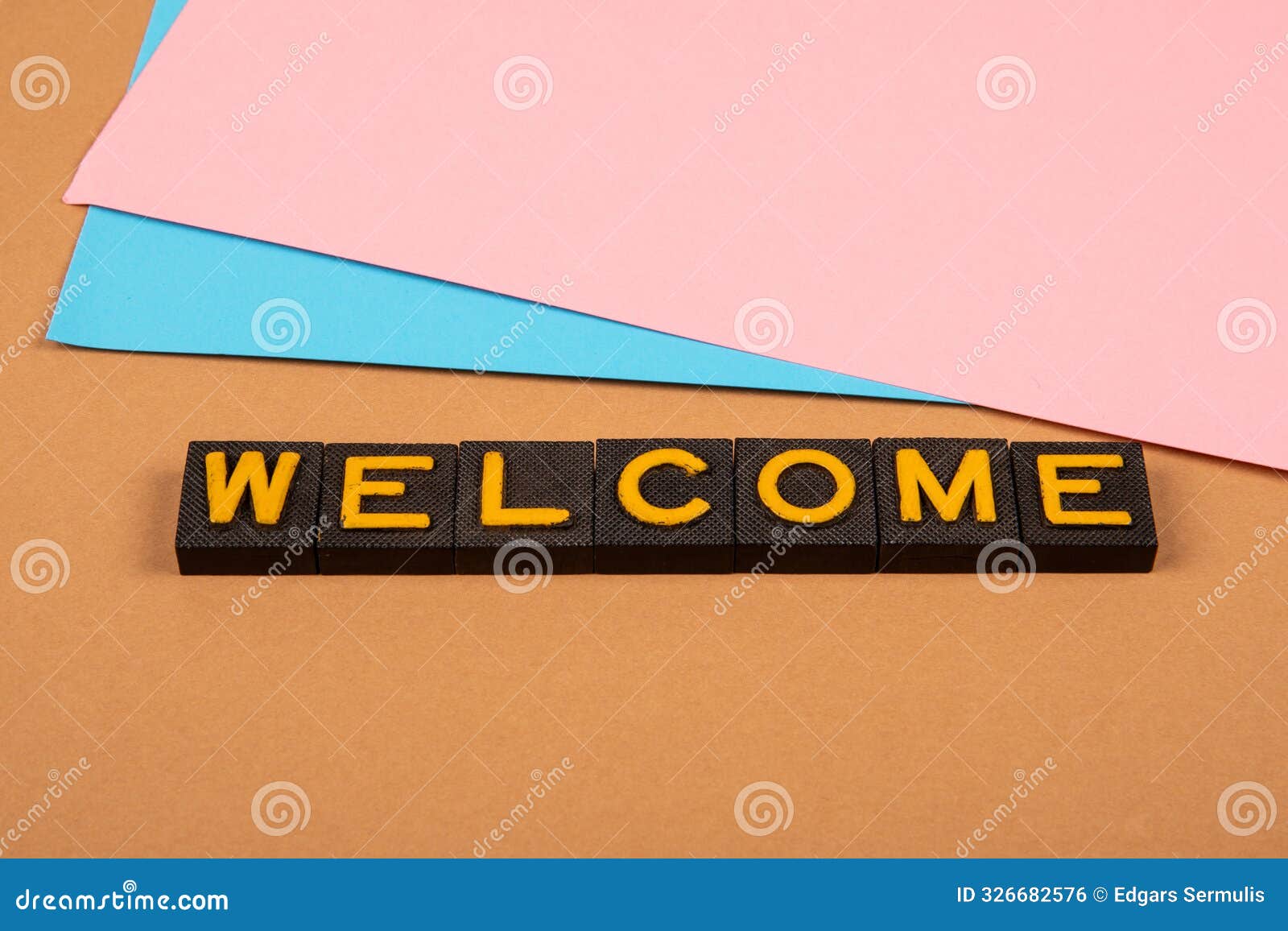 Welcome Concept. Old Letter Tiles on a Colored Paper Stock Photo ...