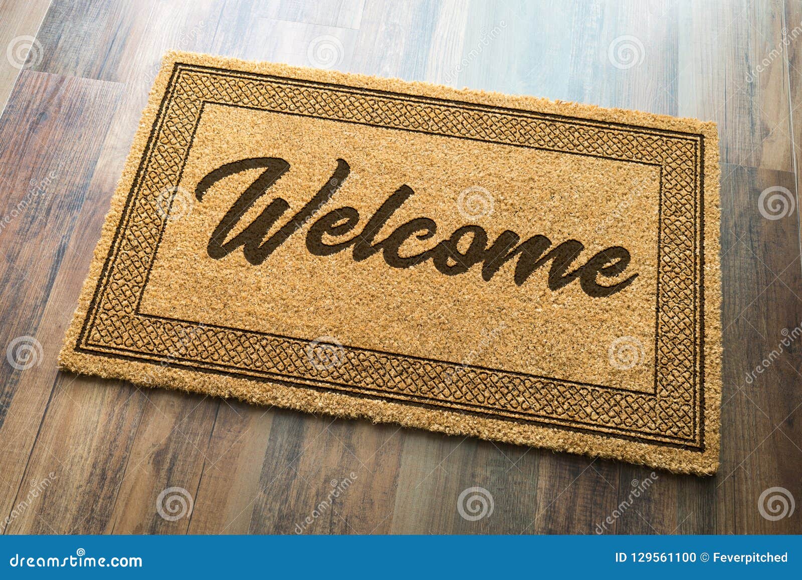 Welcome Mat on a Wood Floor Background Stock Photo - Image of doormat ...