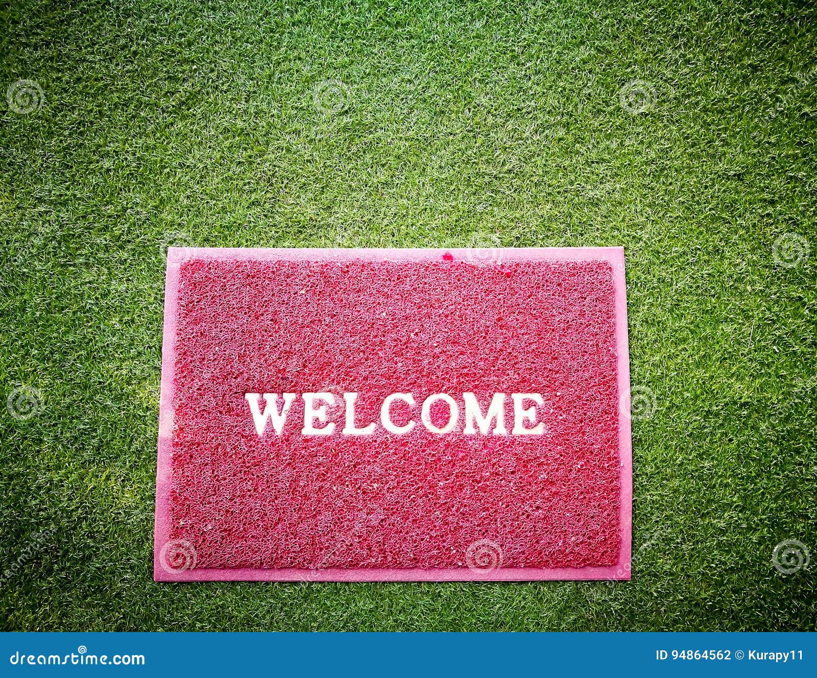 Welcome Red Mat on Green Grass . Stock Photo - Image of household ...