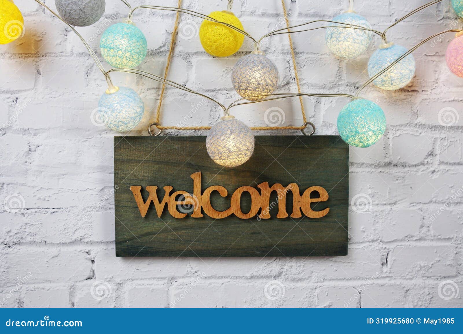 Welcome Sign Hanging on Grunge Cement Wall Background Stock Photo ...