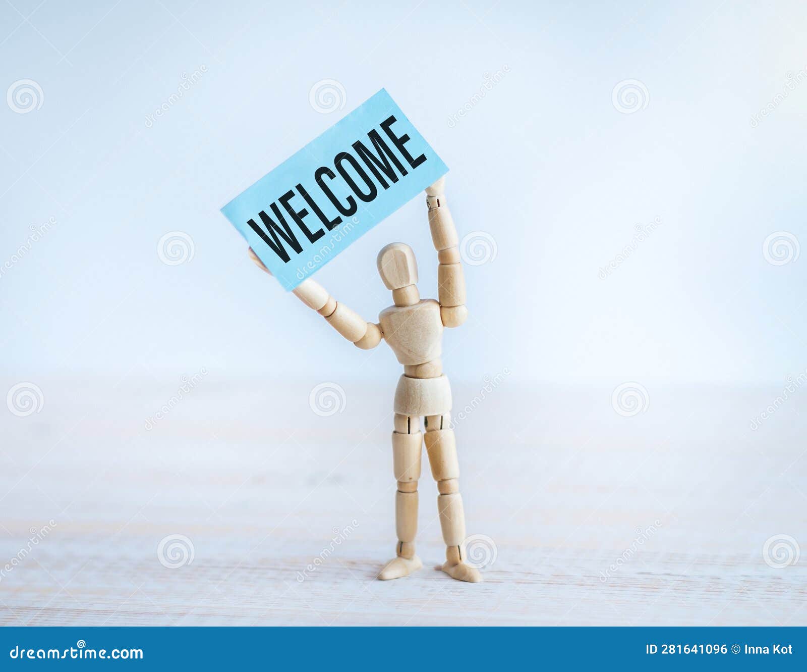 Welcome Text on Paper in the Hands of a Wooden Man. Stock Photo - Image ...