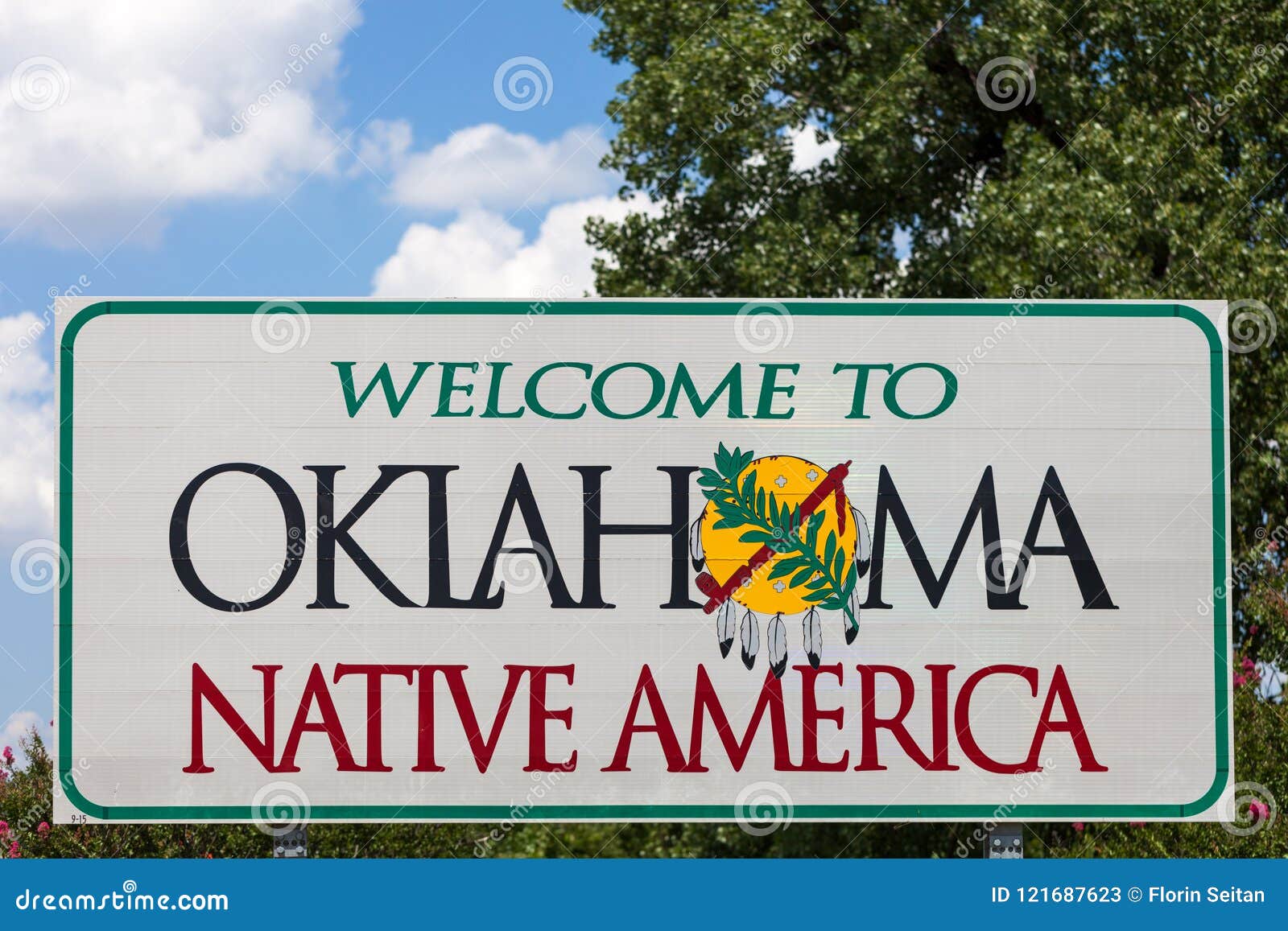 Welcome To Oklahoma Sign with Blue Sky and Trees in the Background ...