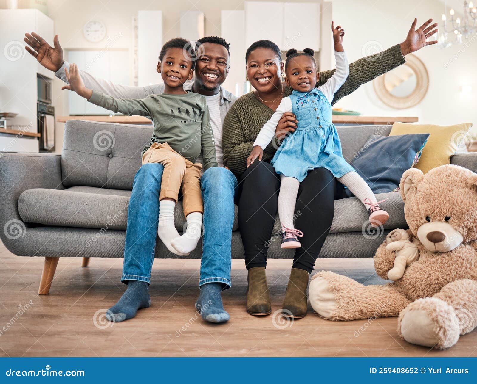 Welcome To Our Wonderful Home. Portrait of a Happy Young Family Having ... Welcome To Our Wonderful Home. Portrait of a Happy Young Family Having ...