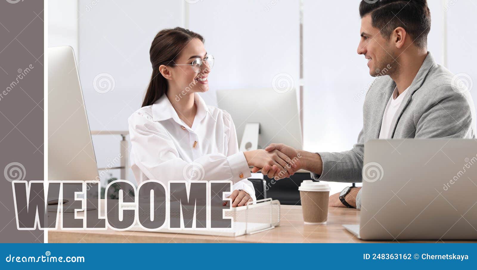 Welcome To Team. Employee Shaking Hands with Intern in Office Stock ...