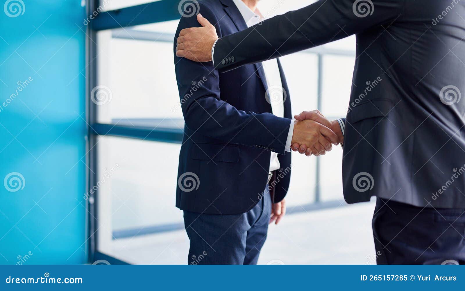 Welcome. Two Businessmen Shaking Hands in the Lobby. Stock Image ...