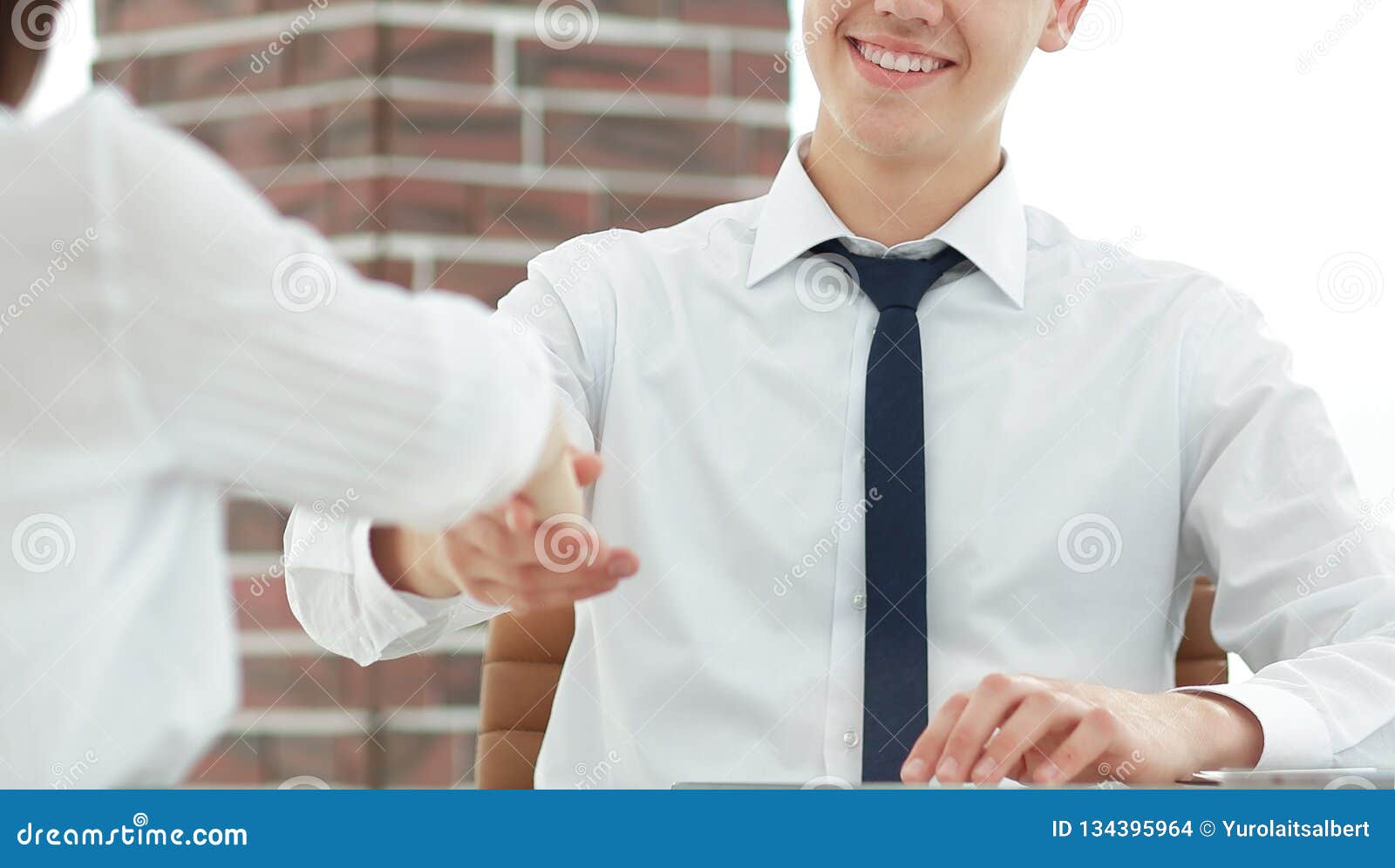 Welcoming Handshake of a Manager and the Customer in the Office. Stock ...