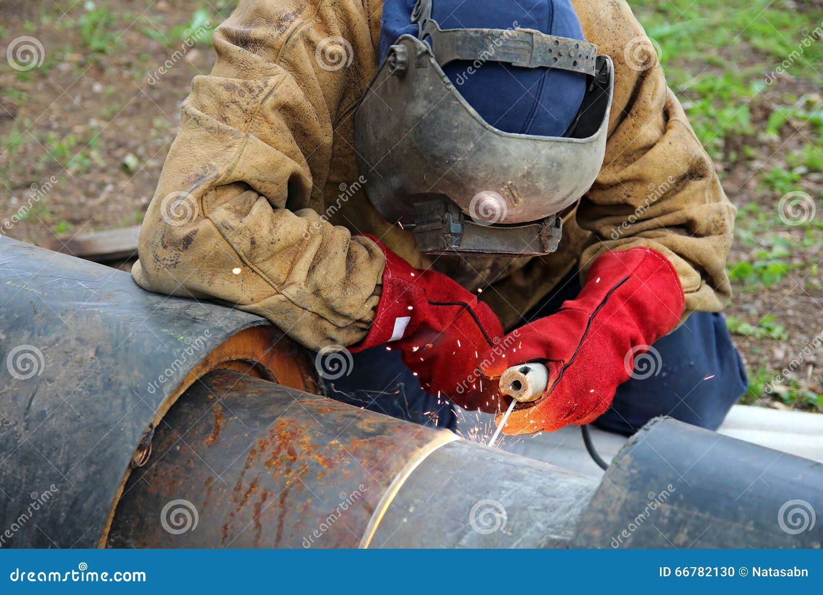 Welder in Action stock photo. Image of heat, labor, outdoors - 66782130