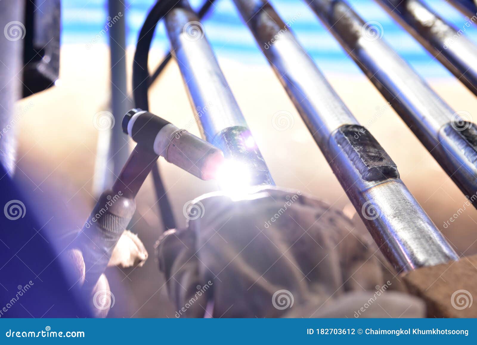 Welder in Blue Uniform Welding the Workpiece Stock Photo - Image of ...